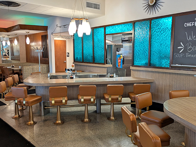 Those turquoise dividers and caramel-colored counter stools aren't retro by design&mdash;they're authentic survivors from an era when conversation trumped cell phones.