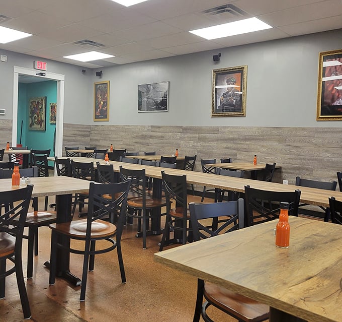 Simple wooden tables and framed artwork create an atmosphere where the food, not the decor, takes center stage.