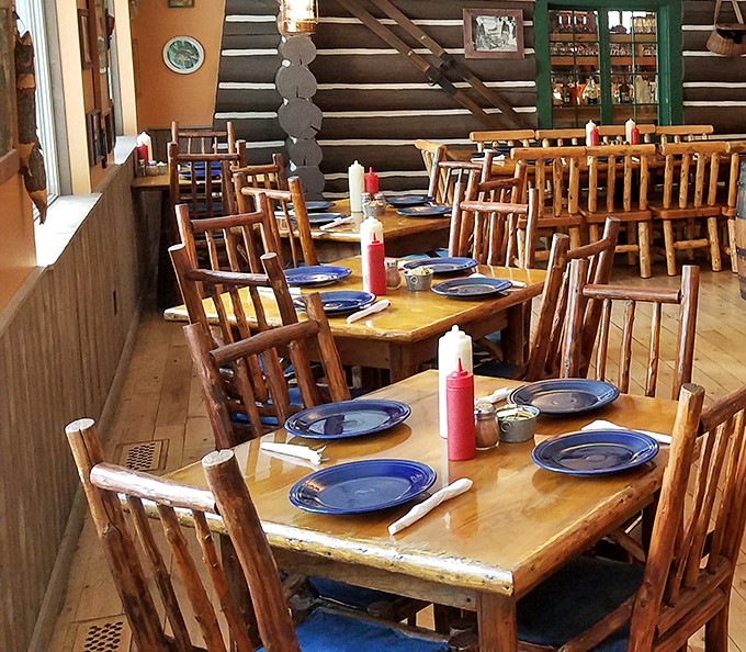 Blue plates await hungry diners at wooden tables where countless Wisconsin fish fry stories have been shared over generations.