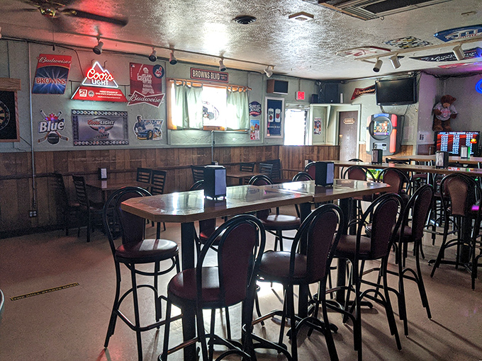 Step inside and you're greeted by the classic wood-paneled warmth of a true neighborhood bar&mdash;beer signs glowing like beacons of hospitality against the walls.