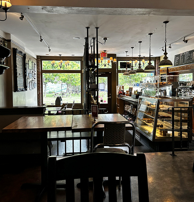 Warm pendant lighting and wooden tables create that rare atmosphere where both hipsters and retirees feel equally at home.