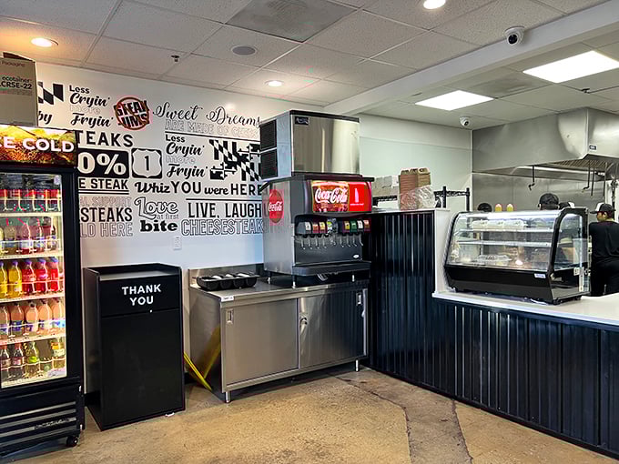 Inside, the black and white typography wall serves as both décor and manifesto. "LIVE, LAUGH, Bite CHEESESTEAKS" isn't just cute – it's a lifestyle.