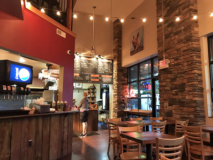 High ceilings, stone accents, and string lights create the perfect backdrop for serious barbecue contemplation. The kind of place where memories are made between bites.