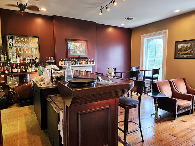 Step into the warm, inviting bar area where rich wood tones and comfortable seating create the perfect prelude to an unforgettable dining experience.