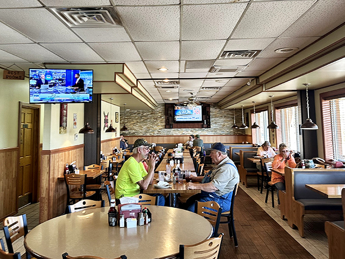 Where everybody might not know your name yet, but they're certainly willing to learn it. The warm wood paneling and cozy booths create that perfect small-town gathering spot.