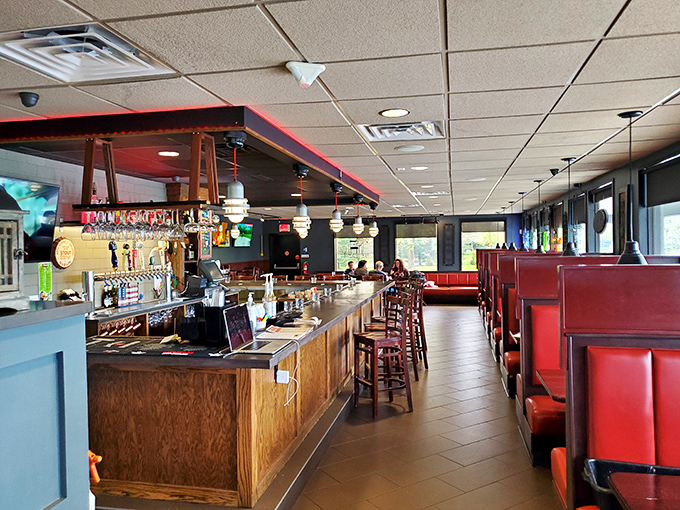 Red booths and wooden accents create that perfect "Cheers" vibe where everybody might not know your name yet, but they'll remember your usual order after visit two.