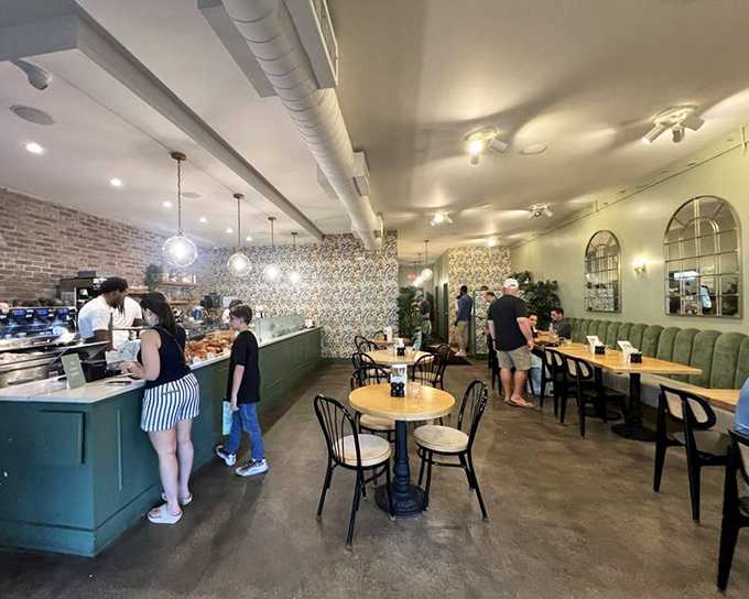 Inside, exposed brick meets elegant wallpaper in a space that feels both sophisticated and comfortable&mdash;the Goldilocks zone of caf&eacute; ambiance.