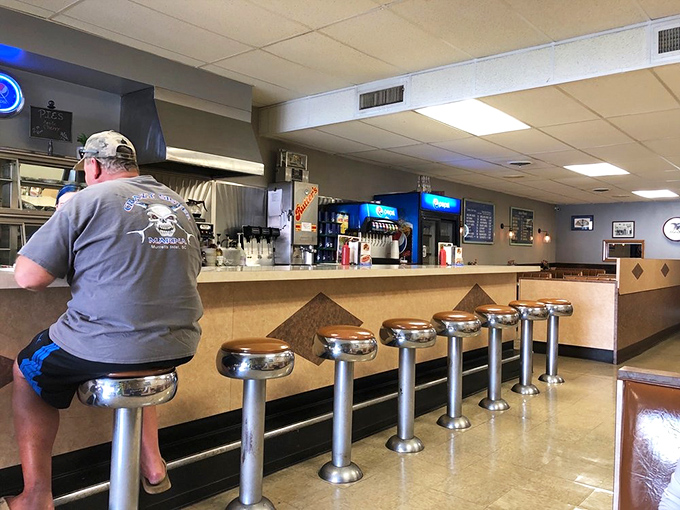 Where time stands still but service doesn't. These chrome stools have supported generations of hot dog enthusiasts seeking their chili-topped fix.
