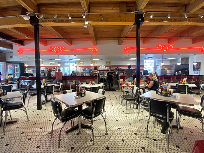 Classic chrome tables, black vinyl chairs, and that hexagonal tile floor&mdash;this isn't retro by design, it's authentic by survival.