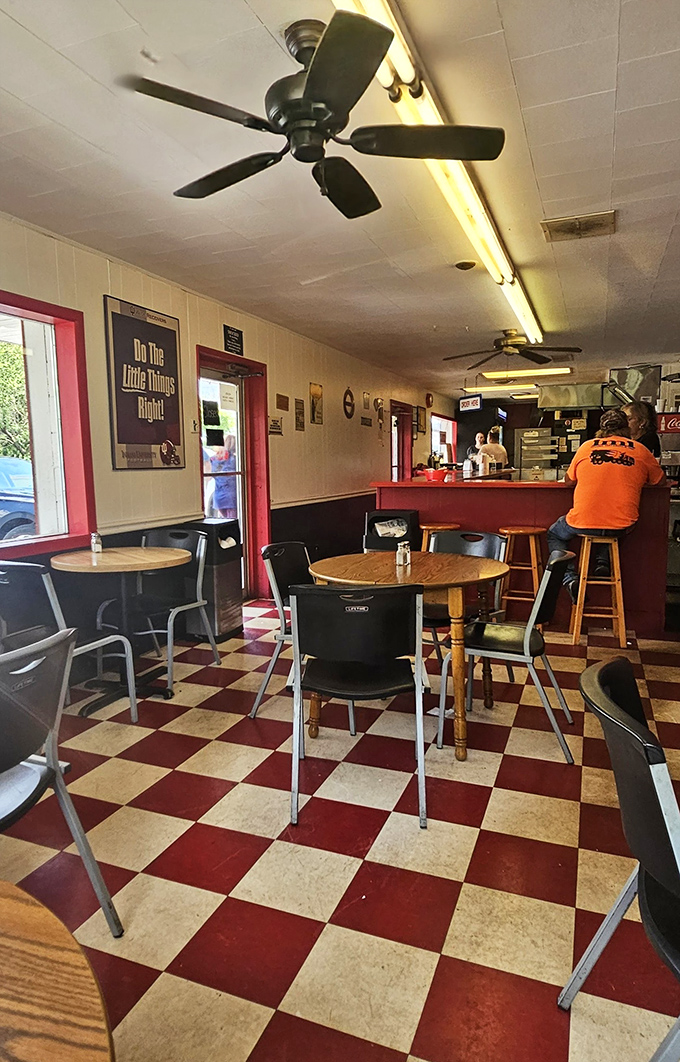 Classic checkered floors and no-nonsense seating tell you everything you need to know&mdash;this place prioritizes burger perfection over interior design trends.