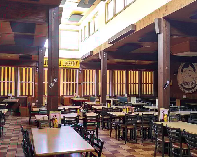 Wood-paneled walls, simple tables, and a banner declaring "A LEGEND..." No arguments here&mdash;just hungry anticipation.