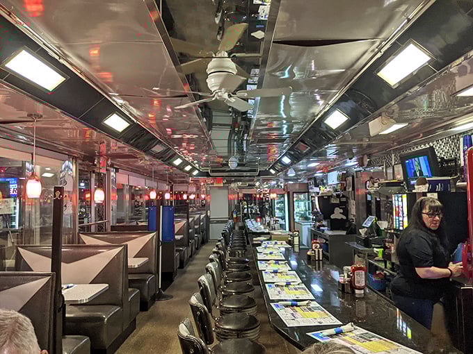 Chrome heaven! The reflective ceiling creates an infinity mirror effect while those counter stools await your spin. Diners aren't just restaurants—they're American performance art.