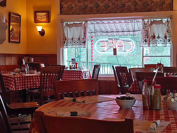 Red-checkered tablecloths and warm wood tones create that "grandma's kitchen" vibe where calories don't count and memories are made.