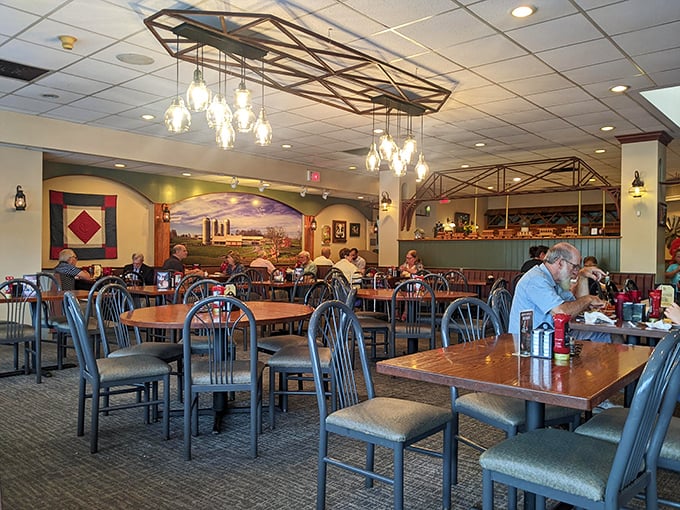 Rustic charm meets comfort in this dining room where farm murals and mason jar lighting create the perfect backdrop for breakfast feasts and hearty conversations.