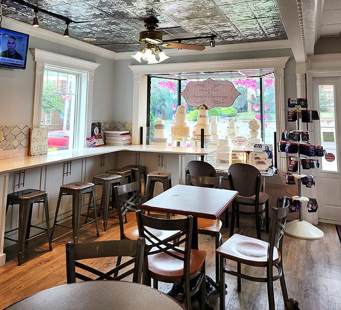 Pressed tin ceilings and wooden chairs create that perfect "stay awhile" atmosphere, where display cases of cakes tempt you to linger over coffee and conversation.