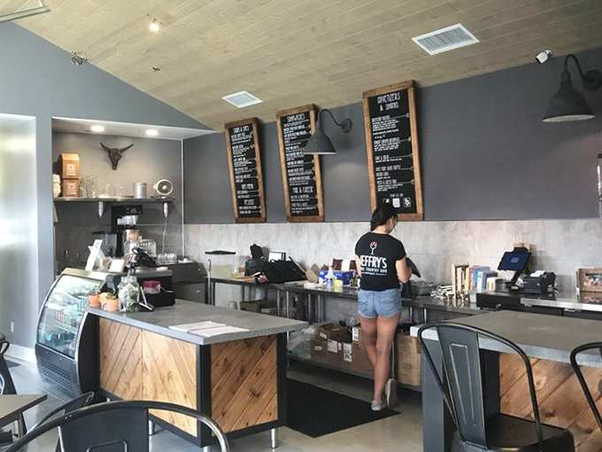 Inside this temple of smoke, chalkboard menus hold court while industrial charm meets down-home comfort perfectly.