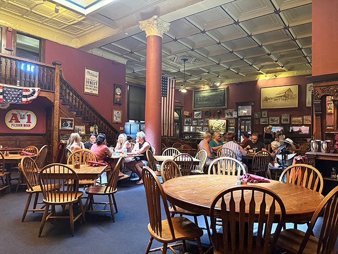 History hangs in the air alongside the American flag in this dining room where Windsor chairs and tin ceilings transport you to territorial Arizona.