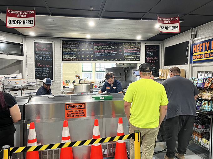 Construction zone alert: serious sandwich engineering happens behind these orange cones that mean delicious business.