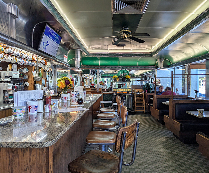 This railroad car interior is what diner dreams are made of &ndash; green trim and all.