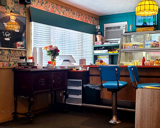 Blue swivel counter stools and vintage floral wallpaper &ndash; stepping into Fred's is like finding a time machine that happens to serve exceptional coffee.