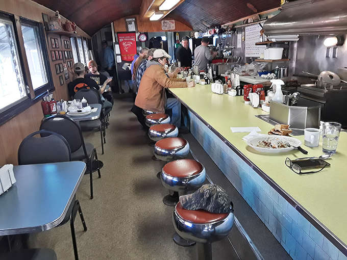 The narrow, wood-paneled interior feels like dining in a train car that happened to stop in breakfast heaven. Those counter stools have witnessed countless morning rituals.