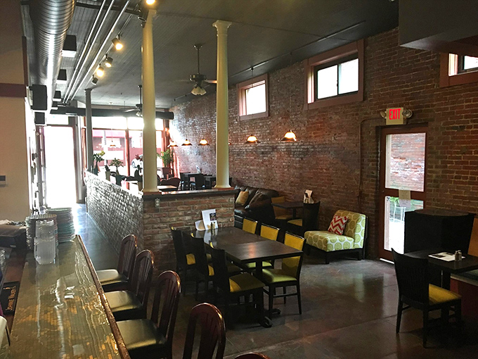 Step inside to discover exposed brick walls, gleaming bar surfaces, and comfortable seating that perfectly balances industrial chic with small-town warmth.