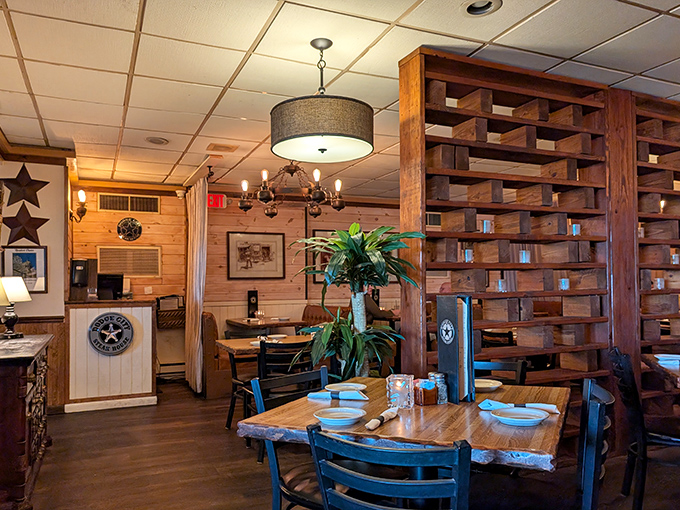 Inside, wooden lattice dividers and star decorations create intimate dining spaces that feel like a cozy frontier outpost.