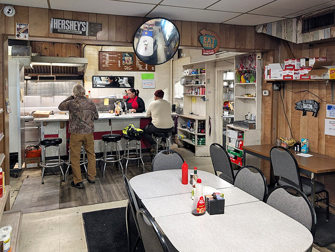 Wood-paneled walls, mismatched furniture, and counter seating create the kind of authentic atmosphere no corporate restaurant consultant could ever design.
