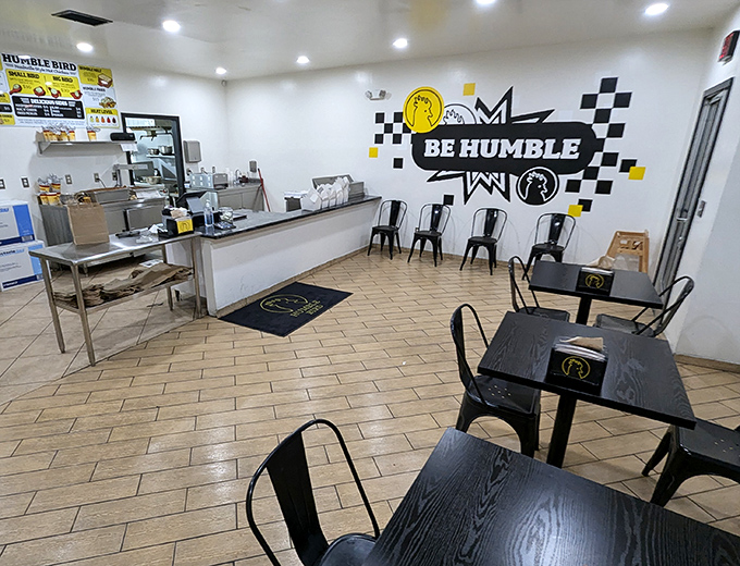 Minimalist chic meets comfort food haven. The black and white checkered wall art says, "We're serious about chicken, not decor."