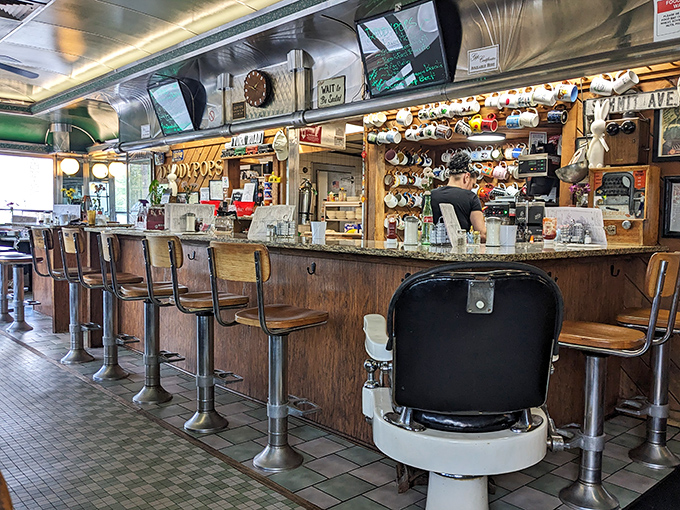 The classic counter with its parade of swivel stools has witnessed countless conversations, first dates, and morning rituals over the decades.