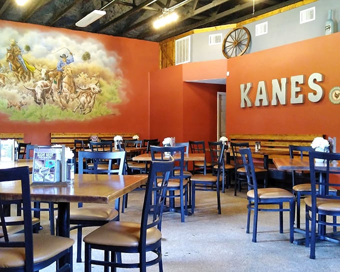Warm terracotta walls adorned with western-themed murals create a cozy atmosphere where every table feels like the best seat in the house.