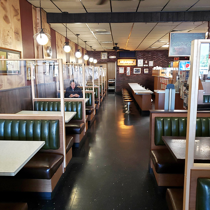 Classic green vinyl booths and no-nonsense counter seating create the perfect backdrop for comfort food conversations. This isn't trendy dining&mdash;it's timeless.