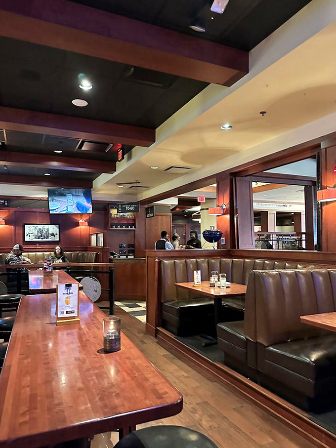 Modern meets nostalgic in Weber's interior, where leather booths and warm wood tones create the perfect backdrop for fire-kissed feasts.