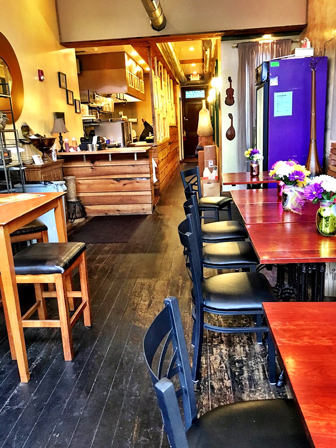 Step inside this cozy haven where wooden tables and warm lighting create the perfect soul food sanctuary.