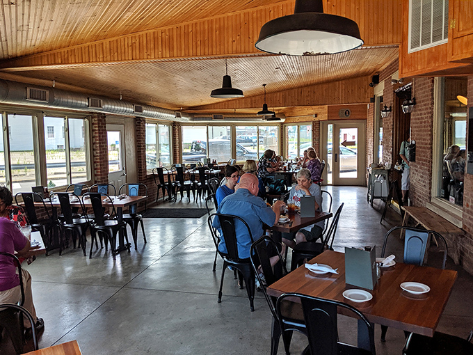 Wooden ceilings, industrial lighting, and comfortable seating create that perfect "I've discovered something special" atmosphere where barbecue memories are made. 