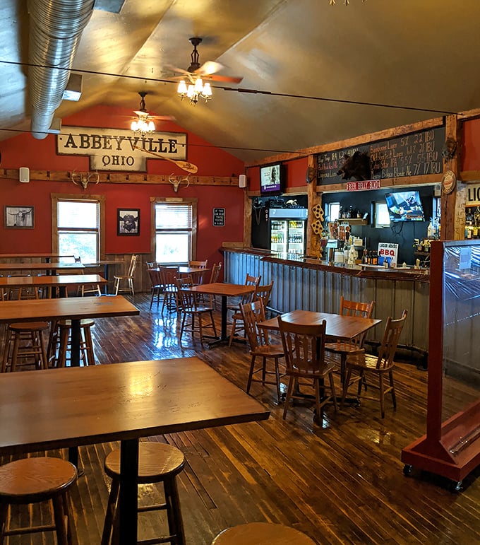 Wooden floors, rustic beams, and that "Abbeyville, Ohio" sign create the perfect backdrop for the meat-centric magic about to unfold.