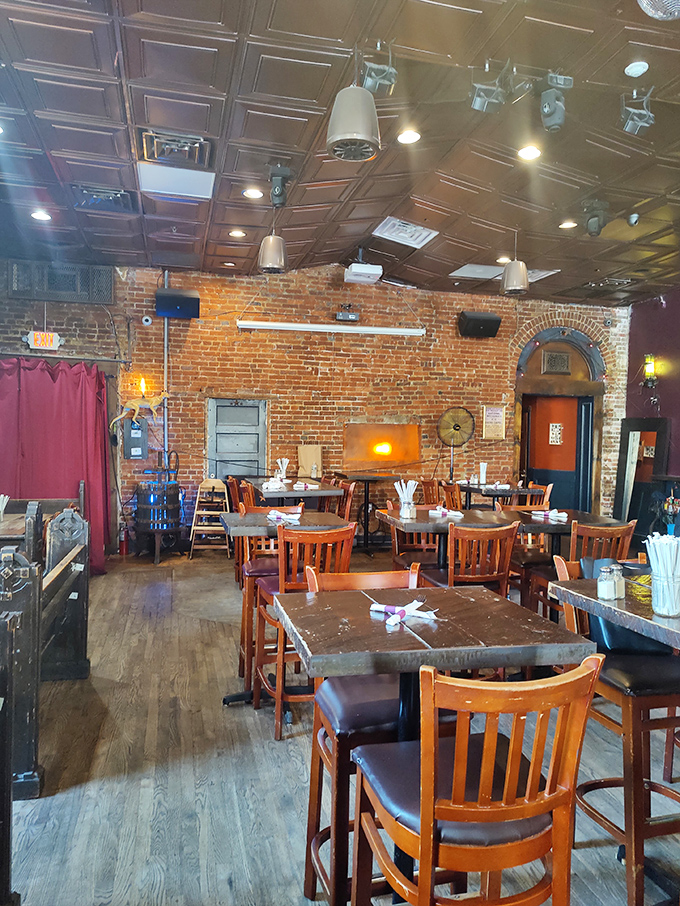 Where history meets hospitality. Exposed brick walls, warm wooden tables, and that magnificent tin ceiling create an atmosphere that's equal parts museum and neighborhood hangout.