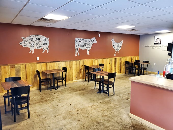 Rustic wooden wainscoting meets educational meat diagrams. The dining room says, "We're serious about barbecue, but not too serious about fancy decor."