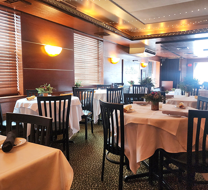 White tablecloths and leopard print carpet create that perfect "fancy but fun" vibe&mdash;like wearing pearls with your favorite jeans.