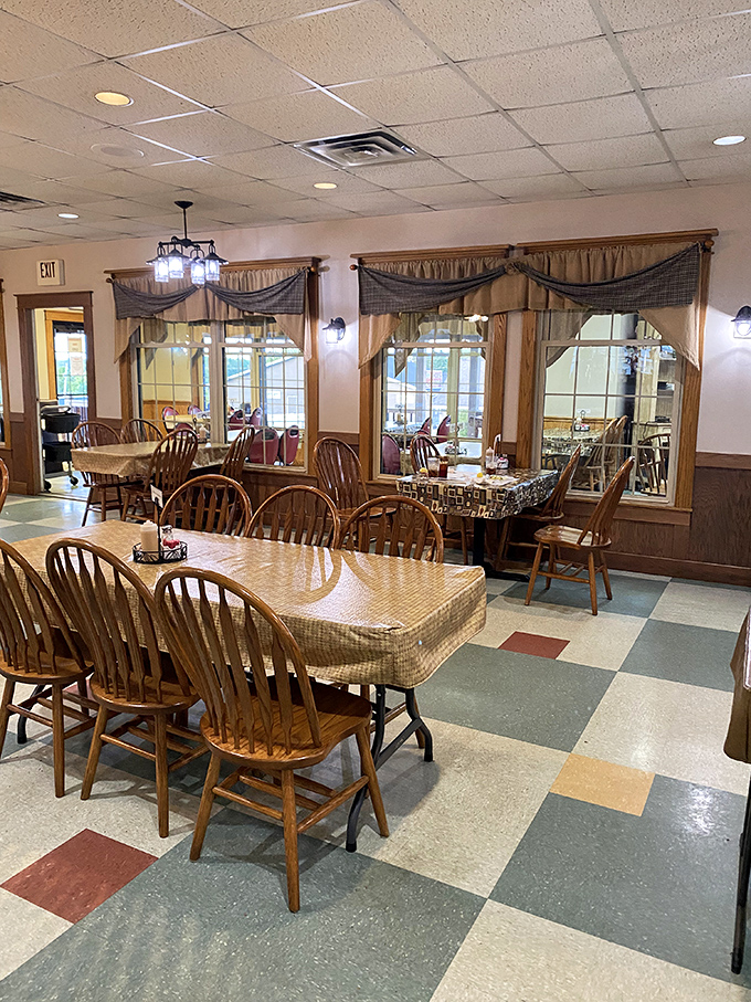 Wooden chairs, checkered floors, and curtained windows create the dining equivalent of a warm hug from your favorite aunt.
