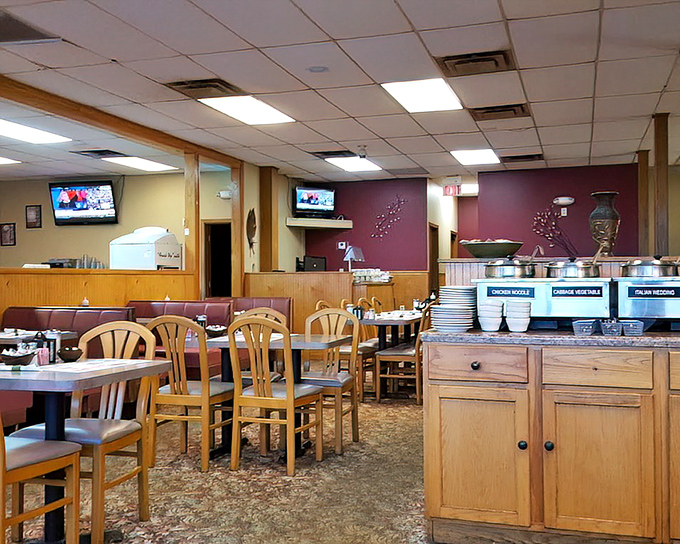 Classic diner ambiance with wood paneling and burgundy accents creates that "everybody knows your name" feeling. The buffet station promises abundance without pretension.