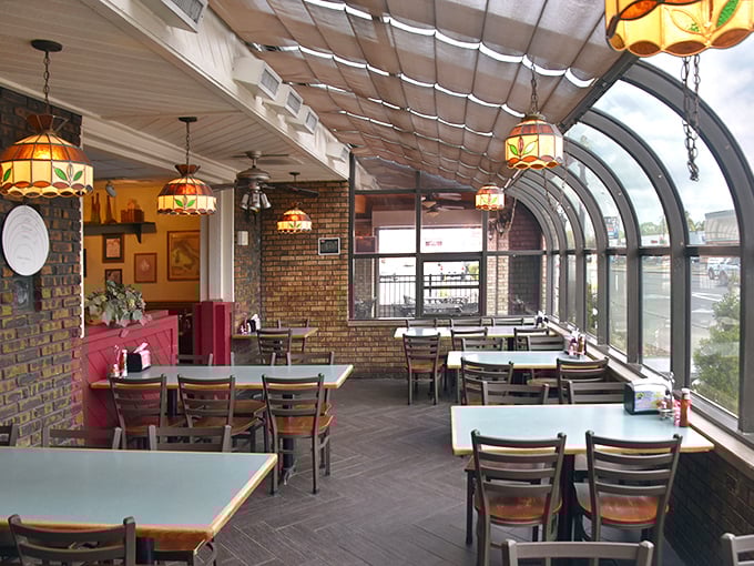 The sunlit solarium dining area feels like eating in a stylish greenhouse, minus the humidity and with significantly better food options.