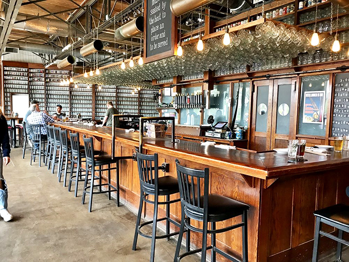 Edison bulbs cast a warm glow over the impressive wooden bar, where beer glasses await their moment of glory. Craft beer heaven exists, and it's in Sawyer.