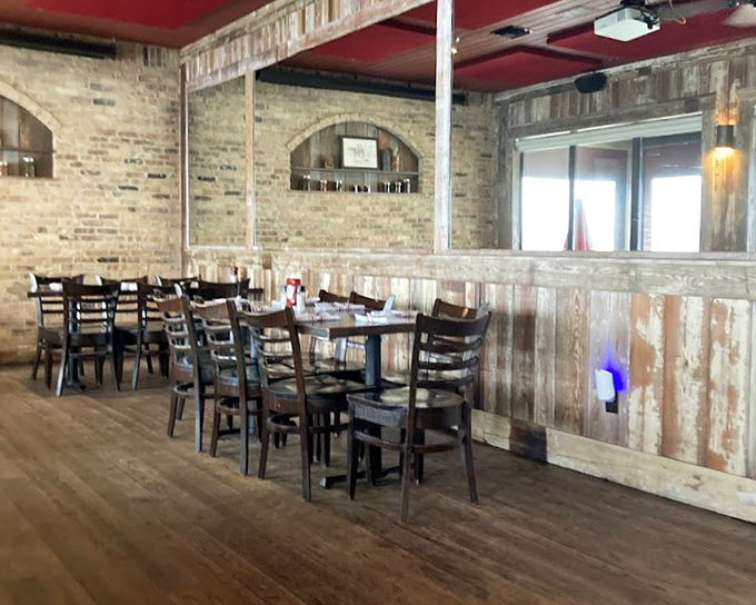 Rustic meets refined in Boshamps' dining room, where exposed brick and weathered wood create the perfect backdrop for seafood that steals the spotlight.