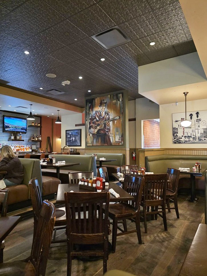 The pressed tin ceiling and warm wood tones create that perfect "I've just discovered my new favorite place" feeling that great restaurants nail.