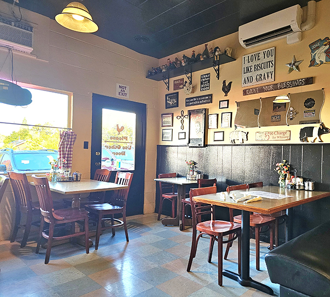 Checkered curtains, rooster decor, and that "I love you like biscuits and gravy" sign &ndash; this isn't interior design, it's a warm hug for your soul.