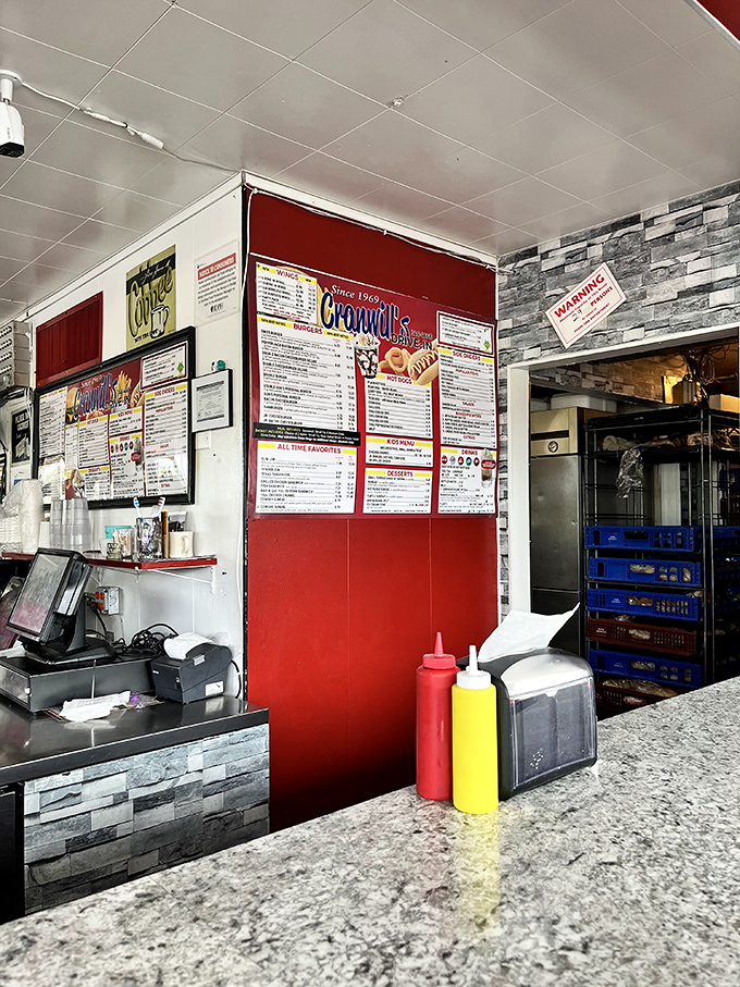 Behind every great drive-in is an ordering counter that's seen it all. The classic red and white color scheme isn't just decoration&mdash;it's a promise of Americana on a plate.