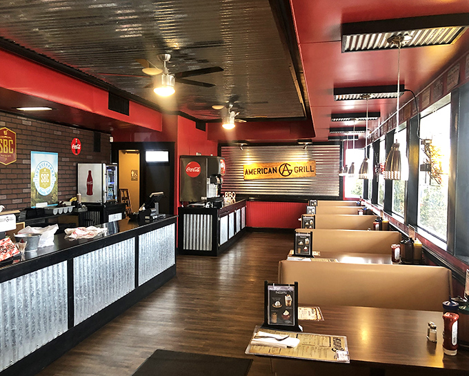 Step inside and the transformation is immediate &ndash; red walls, corrugated metal, and the unmistakable aroma of properly smoked meat. BBQ paradise found.