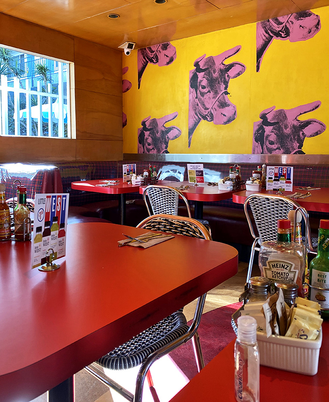 Andy Warhol meets comfort food &ndash; those pop art cows on sunshine-yellow walls watch over diners enjoying their meals in retro-cool booths.