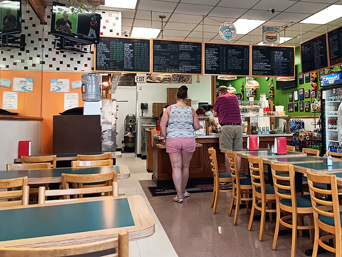 The dining area at Villa Roma offers no-frills comfort &ndash; just wooden chairs, simple tables, and the promise of Italian-American classics that'll make you forget your diet resolutions.